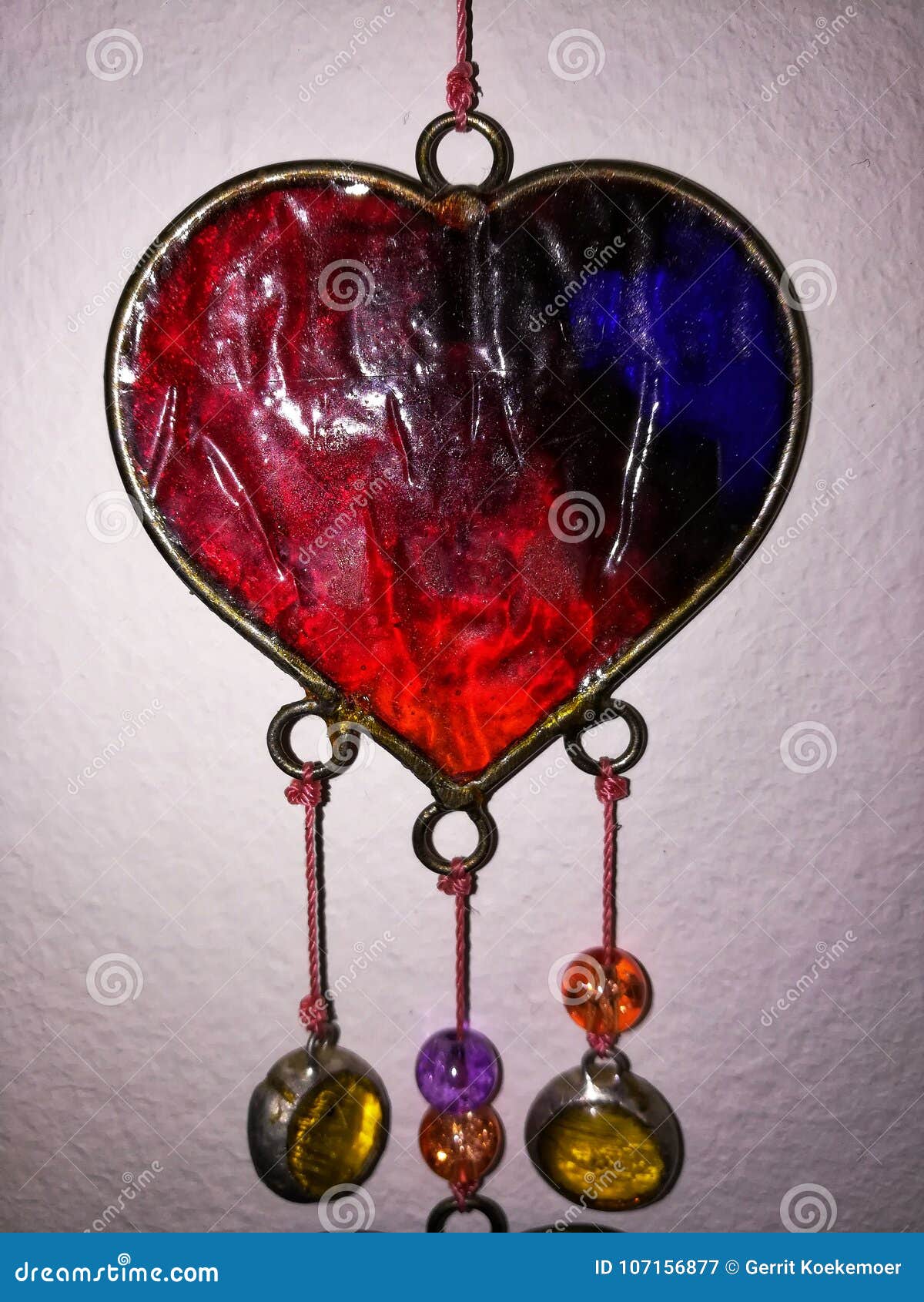 Dangling hearts stock image. Image of glass, purple - 107156877