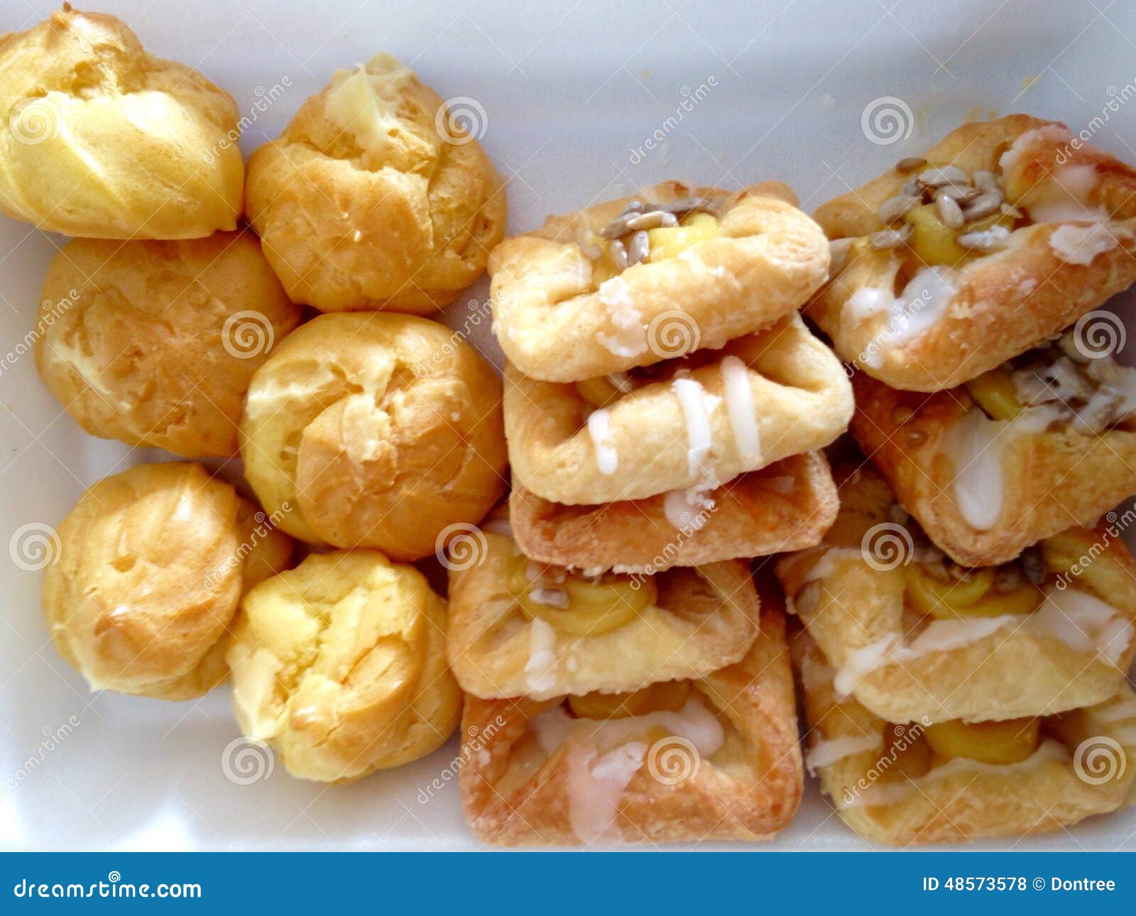 Danish pastries and eclair stock photo. Image of sweet - 48573578