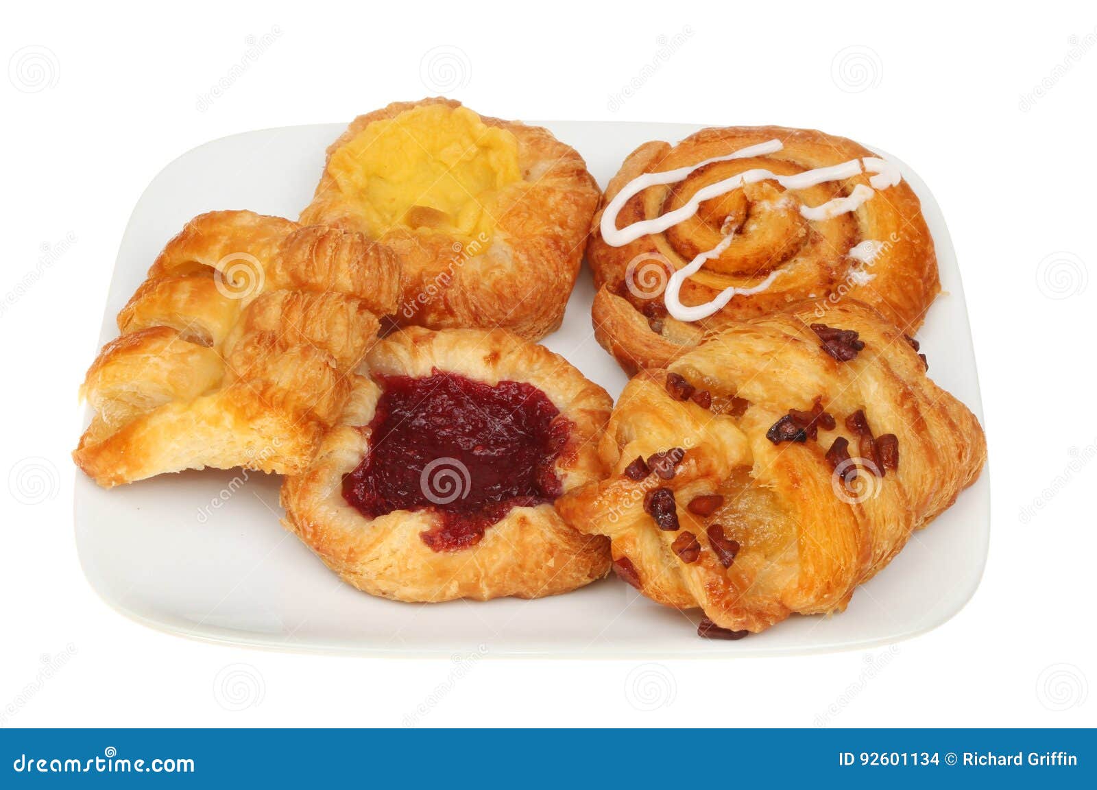 Danish pastries on a plate stock photo. Image of cake - 92601134