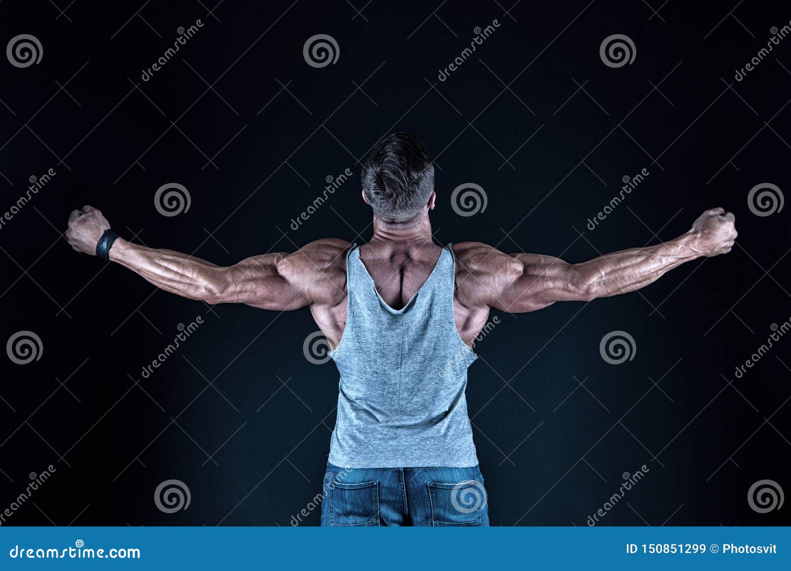 Dare To Be Great. Fit Man Back View. Fit Athlete Showing Muscular Power ... Dare To Be Great. Fit Man Back View. Fit Athlete Showing Muscular Power ...