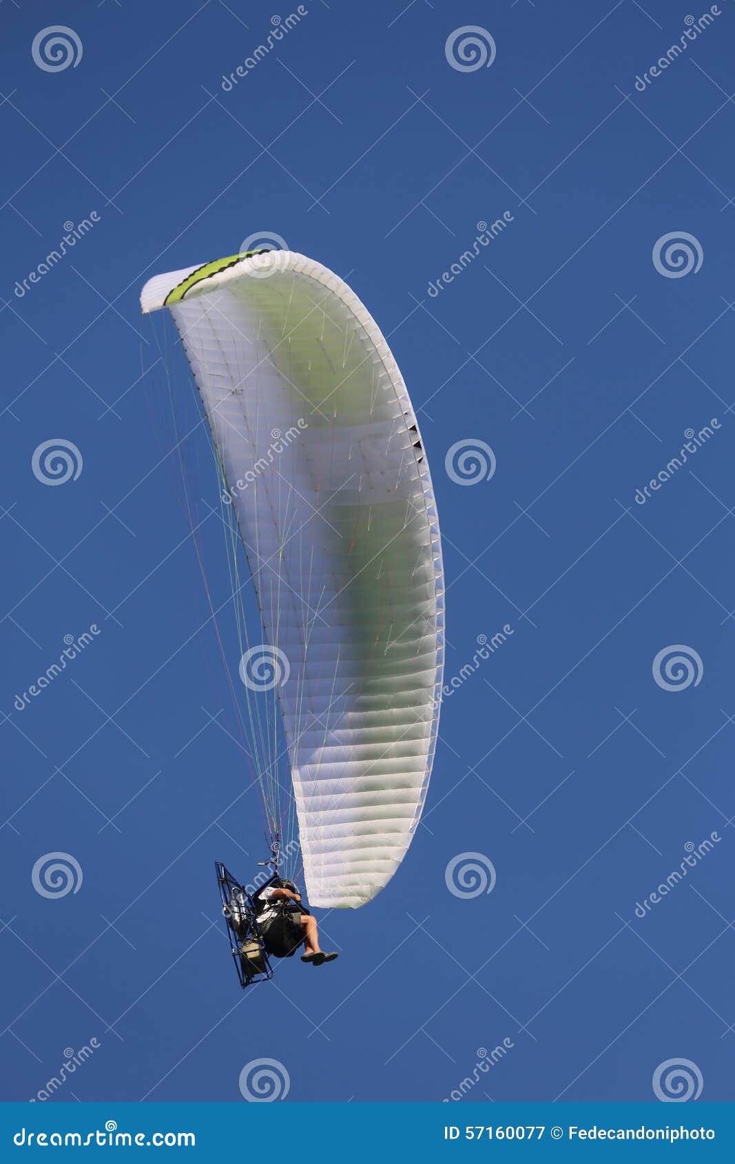 Daredevil Pilot with the Motor Glider Flies Fast in Blue Sky Stock ...