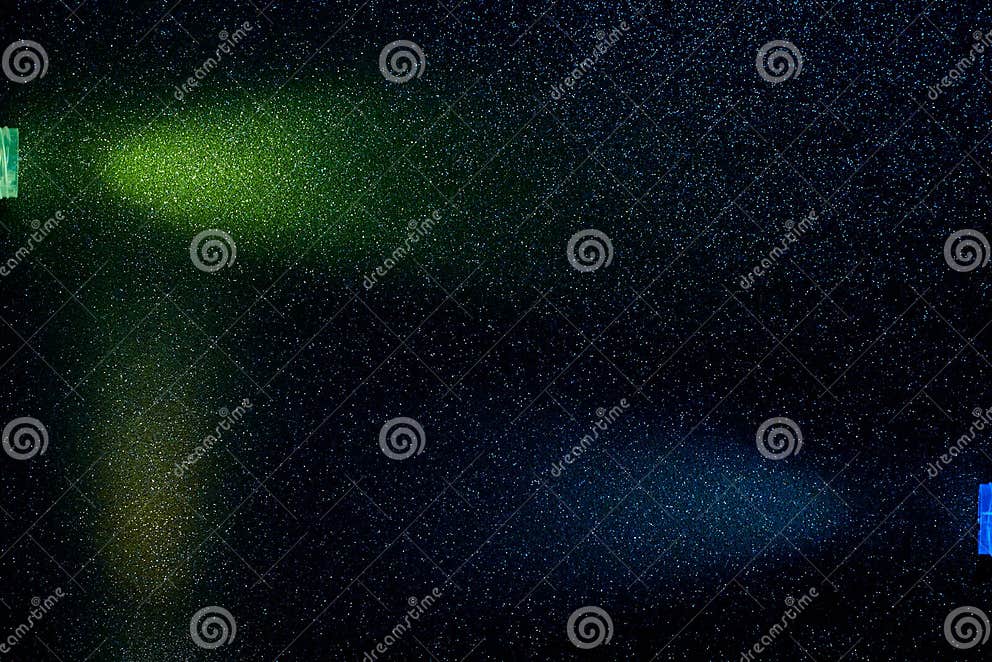 On a Dark Background in a Small Multi-colored Grain, Rays of Light ...