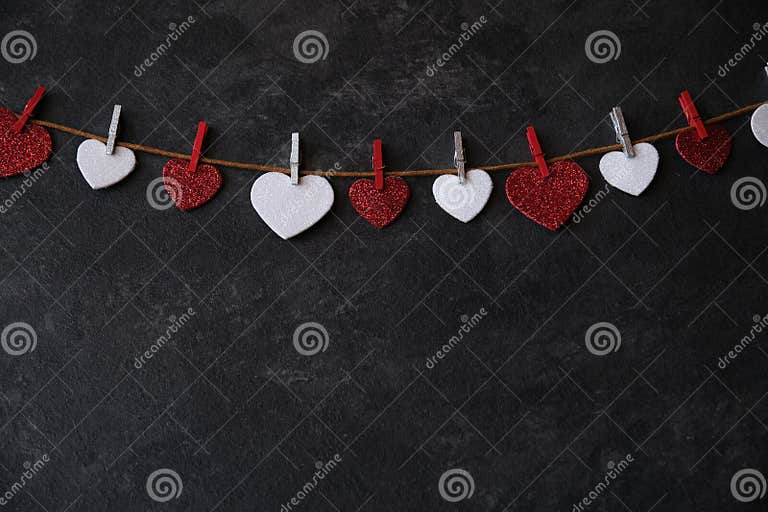 On a Dark Background on a String of Hearts Stock Image - Image of ...