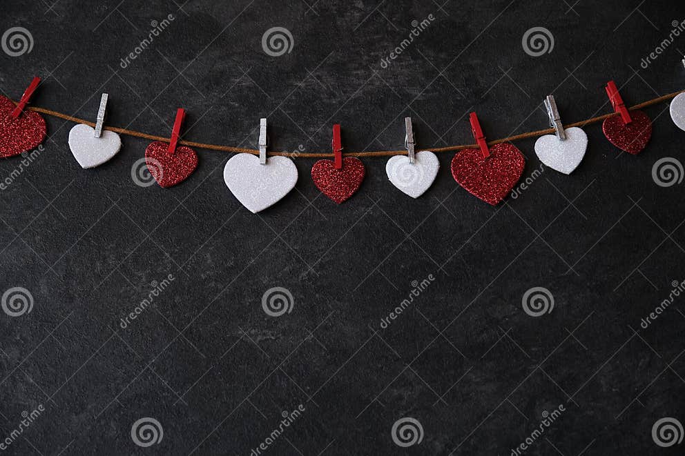On a Dark Background on a String of Hearts Stock Image - Image of ...