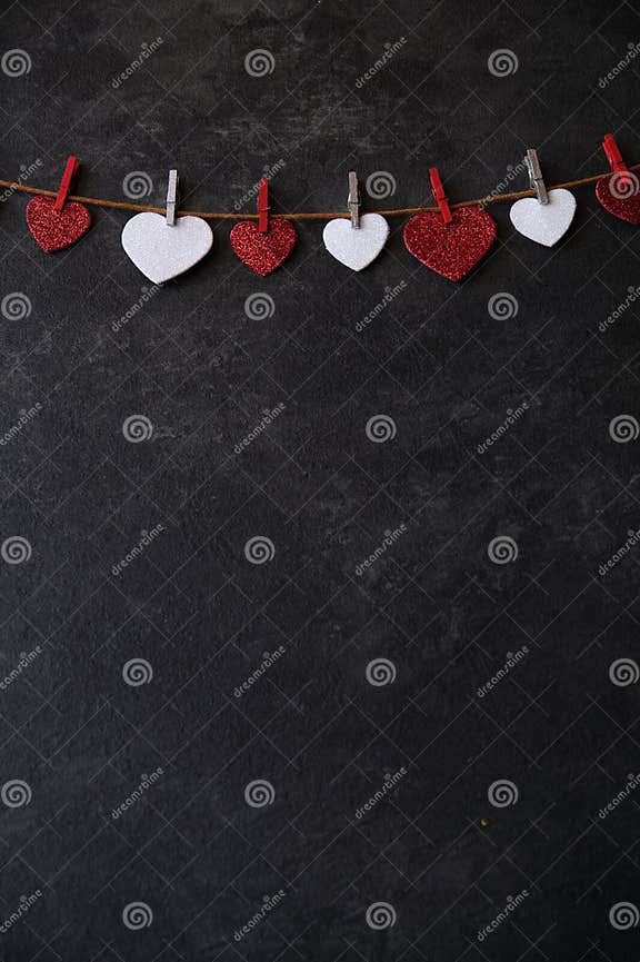 On a Dark Background on a String of Hearts Stock Image - Image of ...