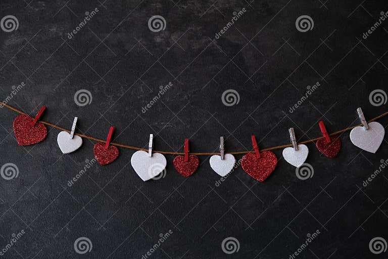 On a Dark Background on a String of Hearts Stock Image - Image of color ...