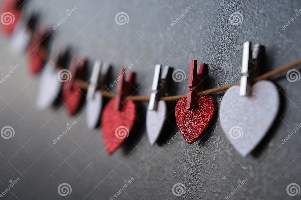 On a Dark Background on a String of Hearts Stock Image - Image of star ...