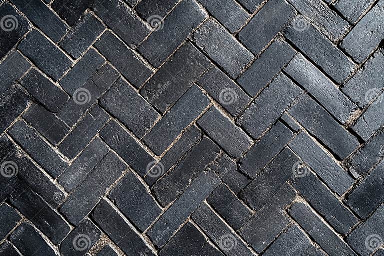 Dark Black Brick Herringbone Pattern Pavement Closeup with Textured ...