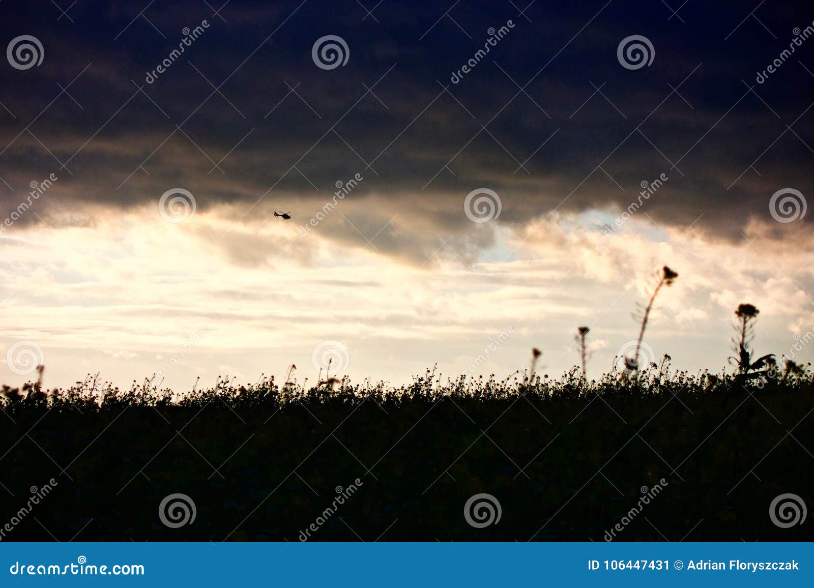 Dark Blue Brooding Sky after a Storm with a Helicopter in the Clouds ...