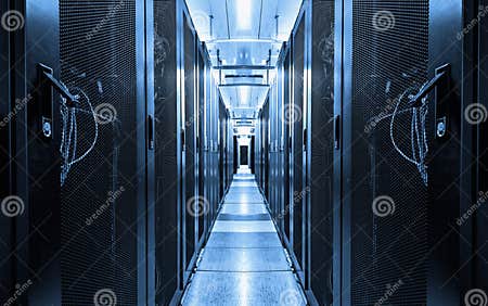 Dark Blue Data Centre Interior with Rows of Hardware Equipment ...