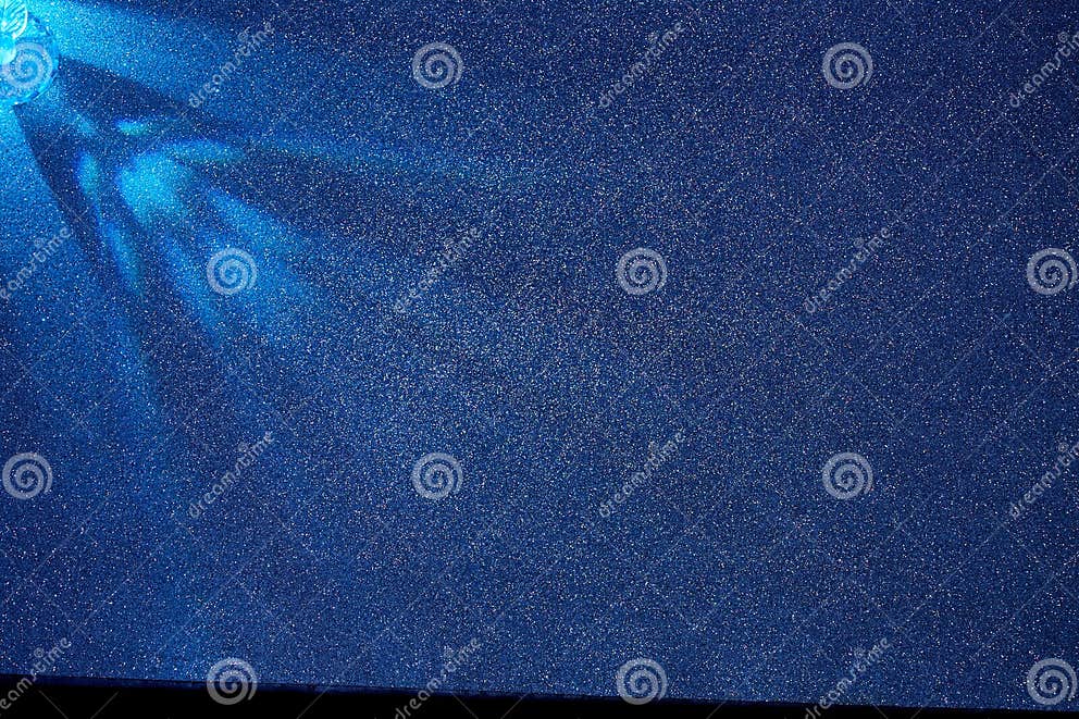 On a Dark Blue Gradient Background, Scattered Light Blue Rays of Light ...
