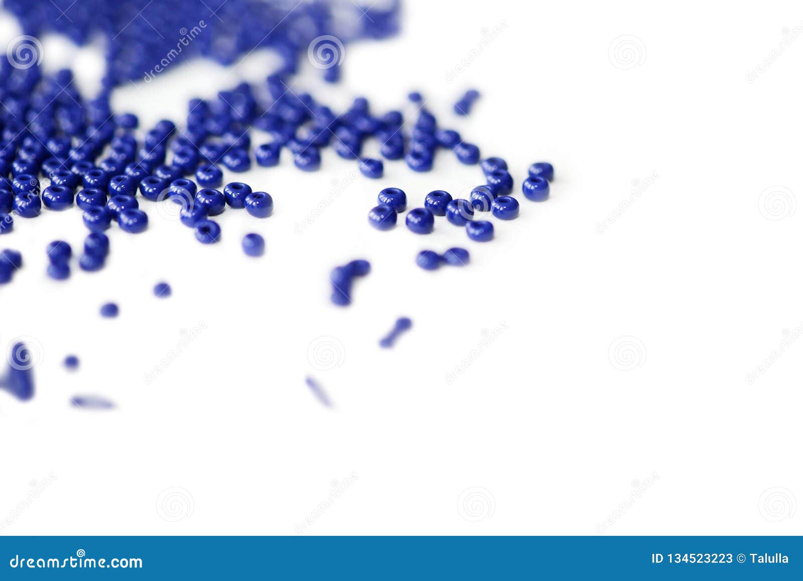 Dark Blue Seed Beads Scattered on a White Surface Stock Image - Image ...