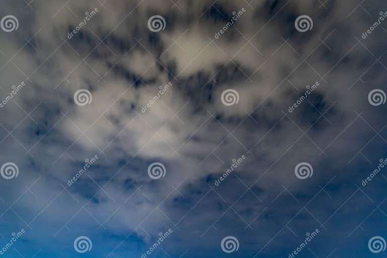 Dark Blue Sky on Long Exposure with Moving Clouds at Night Stock Photo ...