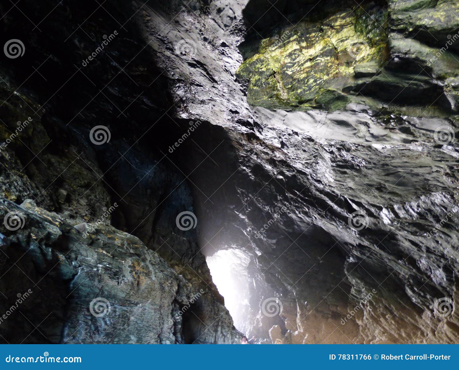 Dark cave rock formations stock photo. Image of though - 78311766