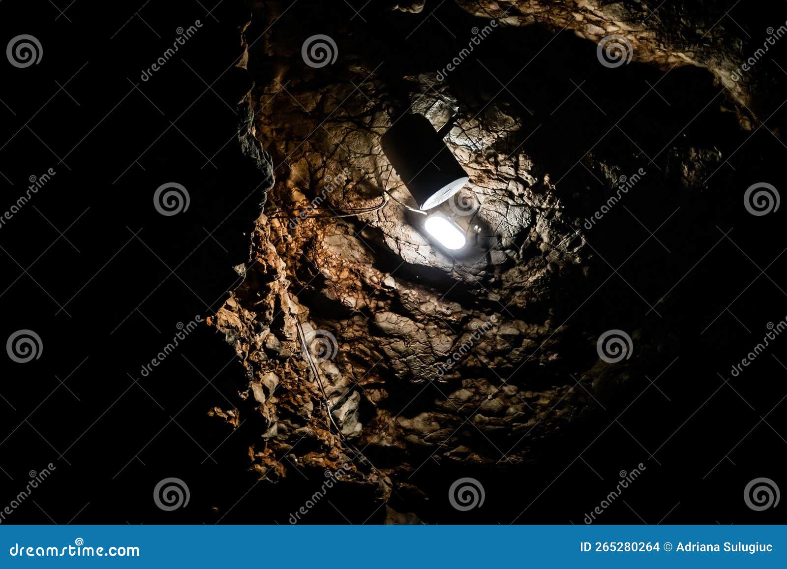 Dark Cave Wall Illuminated by Lamp Stock Photo - Image of electricity ...