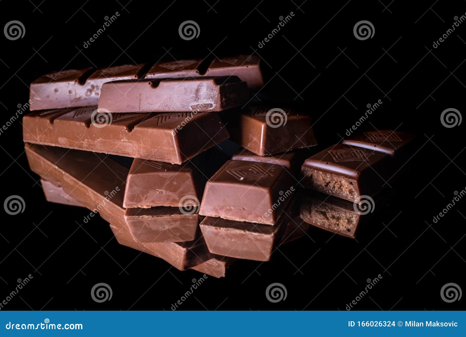 Dark Chocolate with Reflection on Shiny Black Background Stock Photo ...