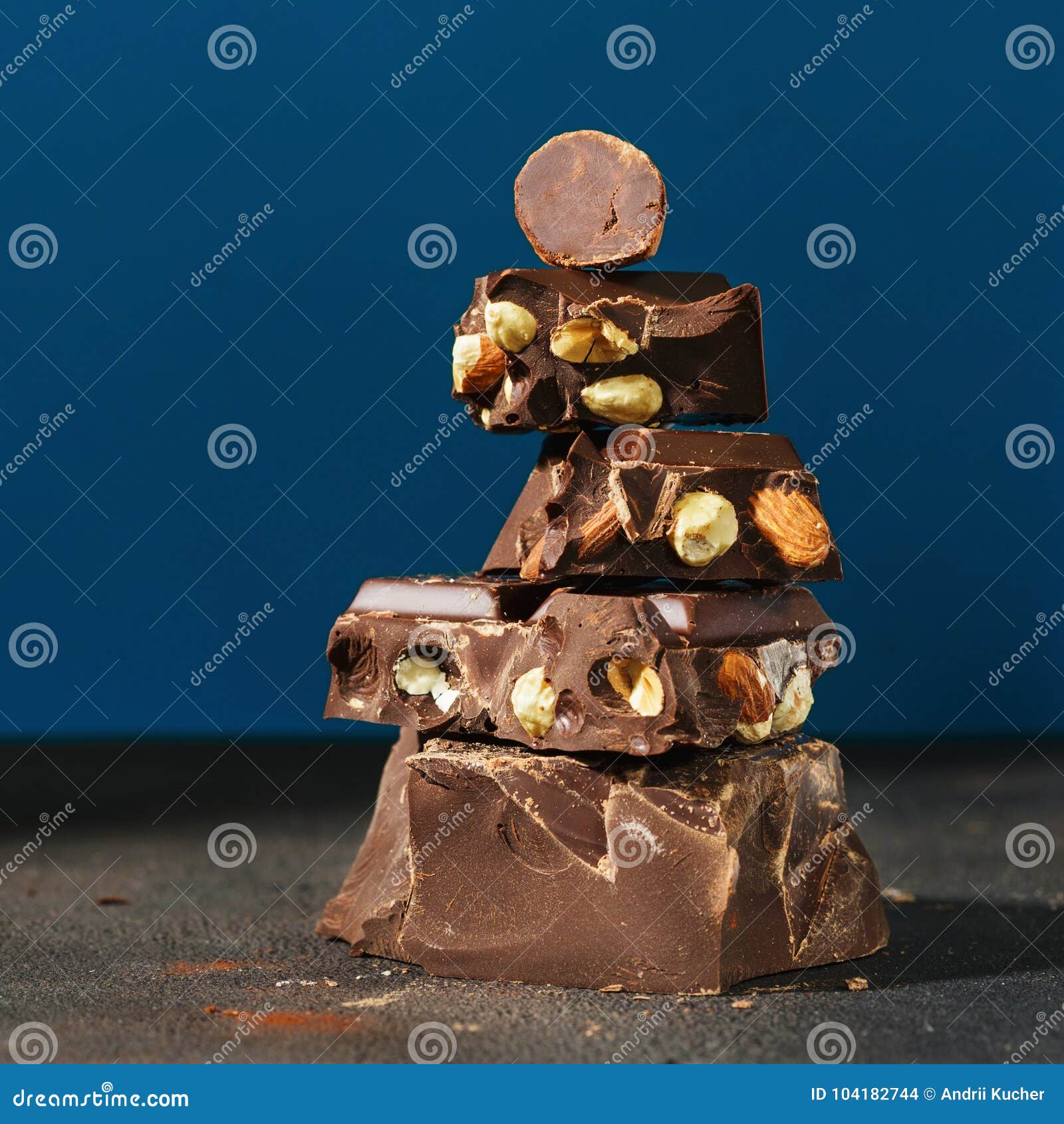 Dark Chocolate Stack on Blue Background with Copy Space Stock Photo ...