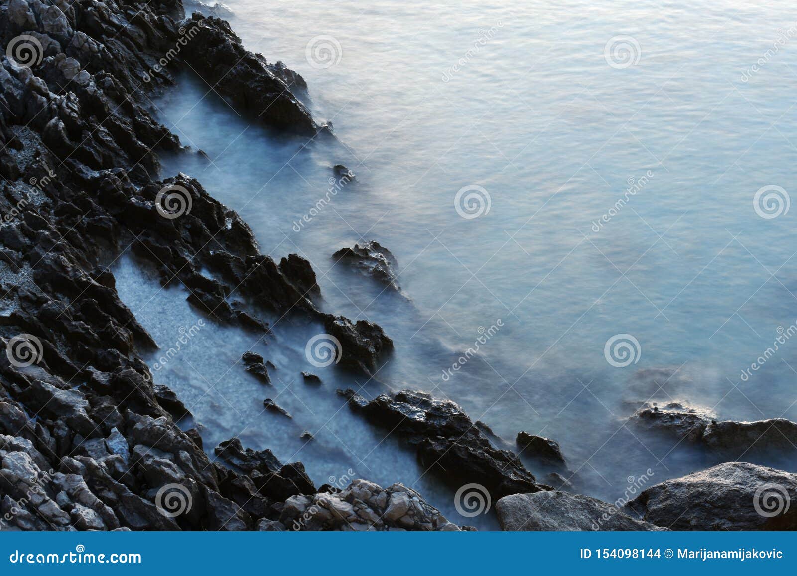 Dark Cliffs, Long Exposure Blue Water Stock Photo - Image of dreamy ...