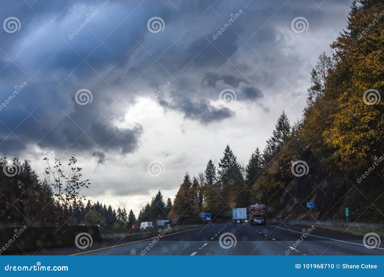 Dramatic Clouds Over Highway in Fall Stock Photo - Image of commute ...
