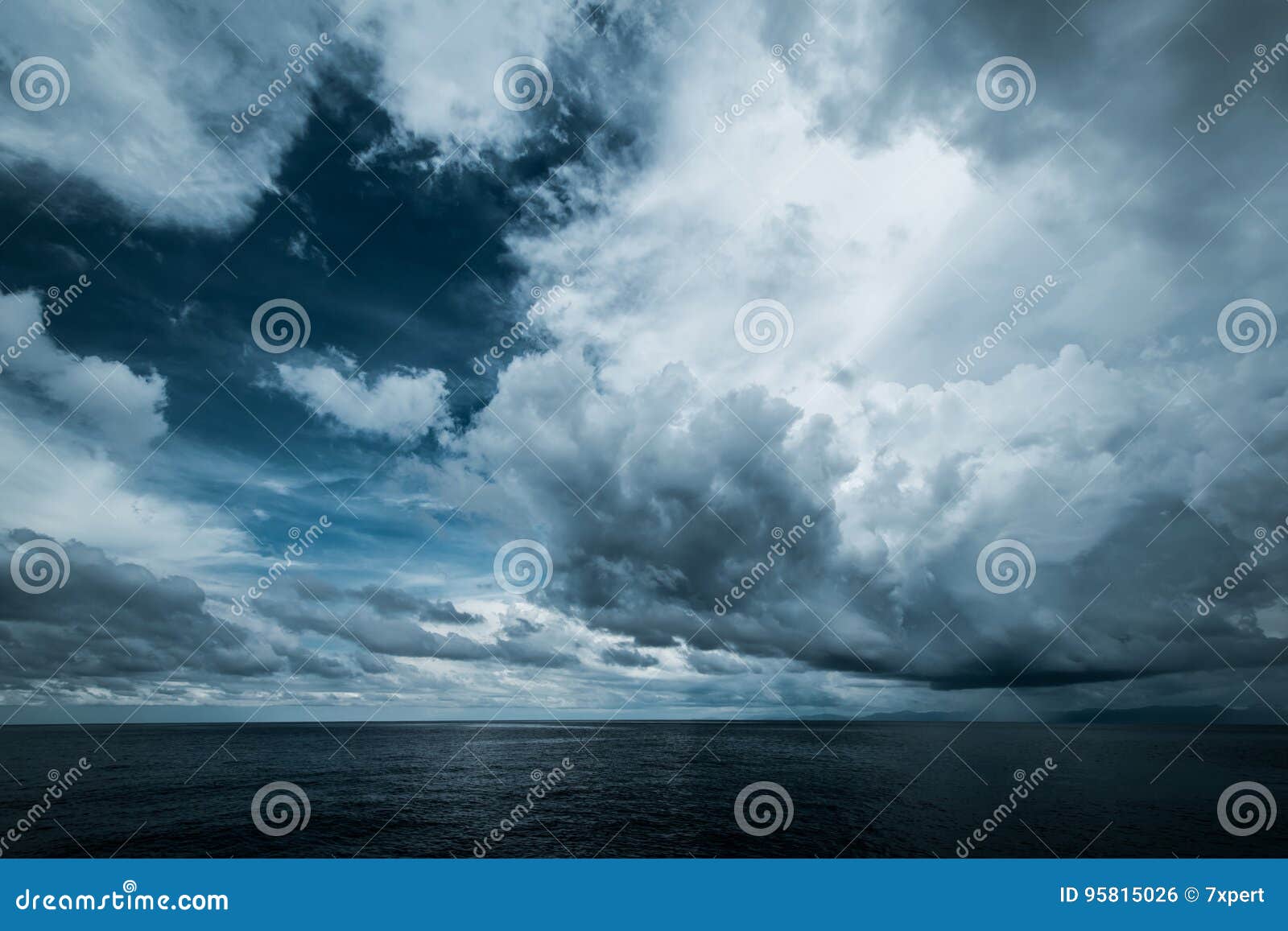 Dark clouds in open ocean stock photo. Image of waves - 95815026