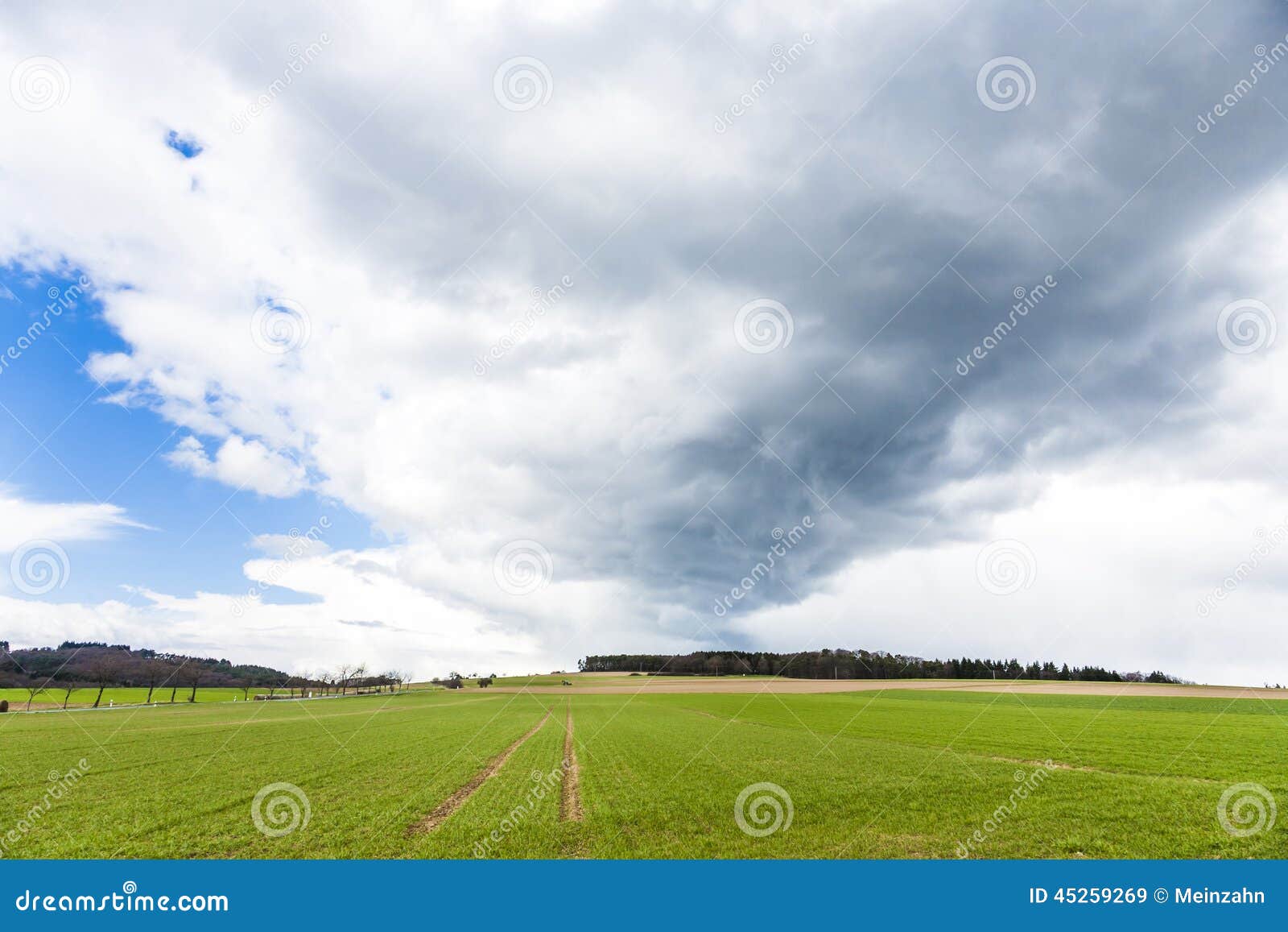 Dark Clouds Over Fields in Spring Stock Image - Image of blue, brown ...