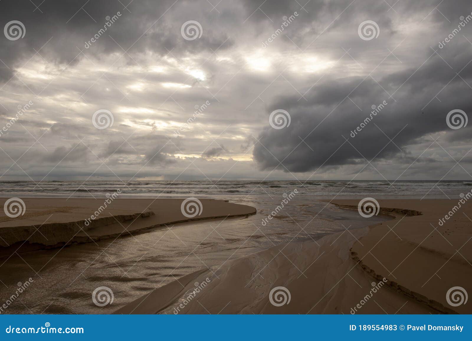 Dark Clouds Over the Sandy Beach Stock Image - Image of appeared, beach ...