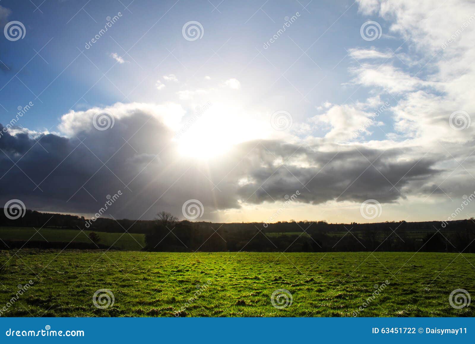 Dark Clouds and Sun on Grass Field Stock Photo - Image of clouds ...