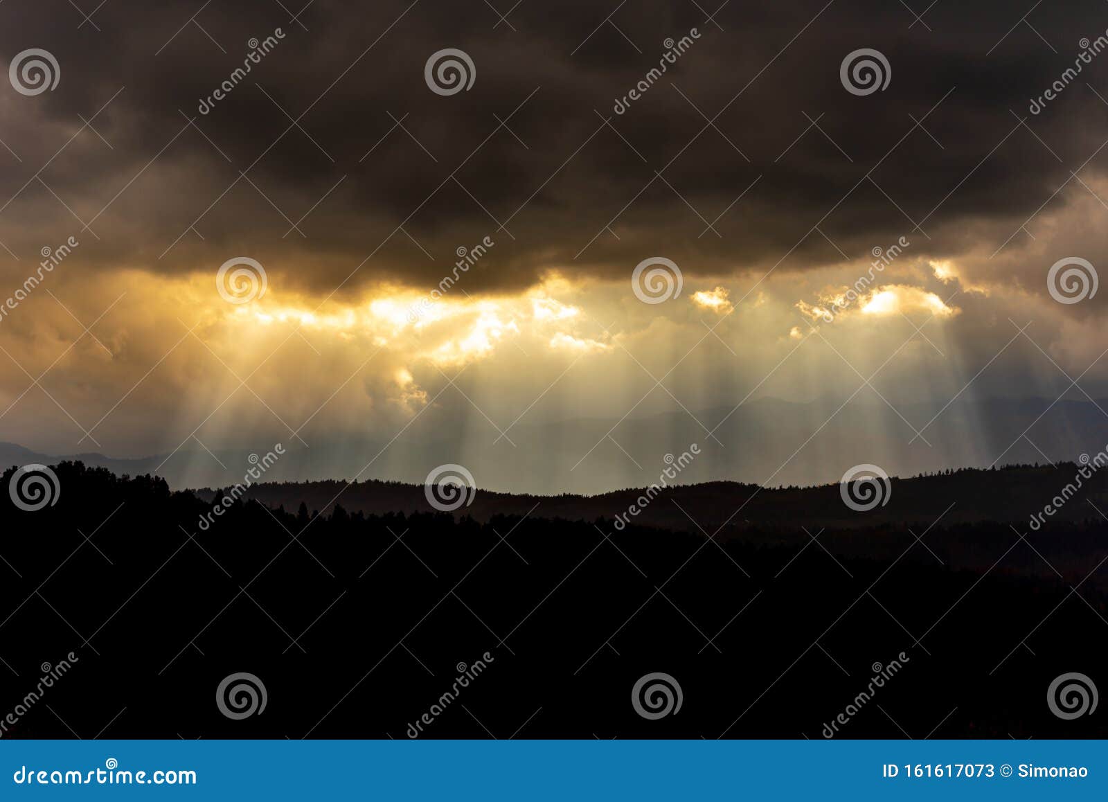 Dark clouds and sun rays stock image. Image of rays - 161617073