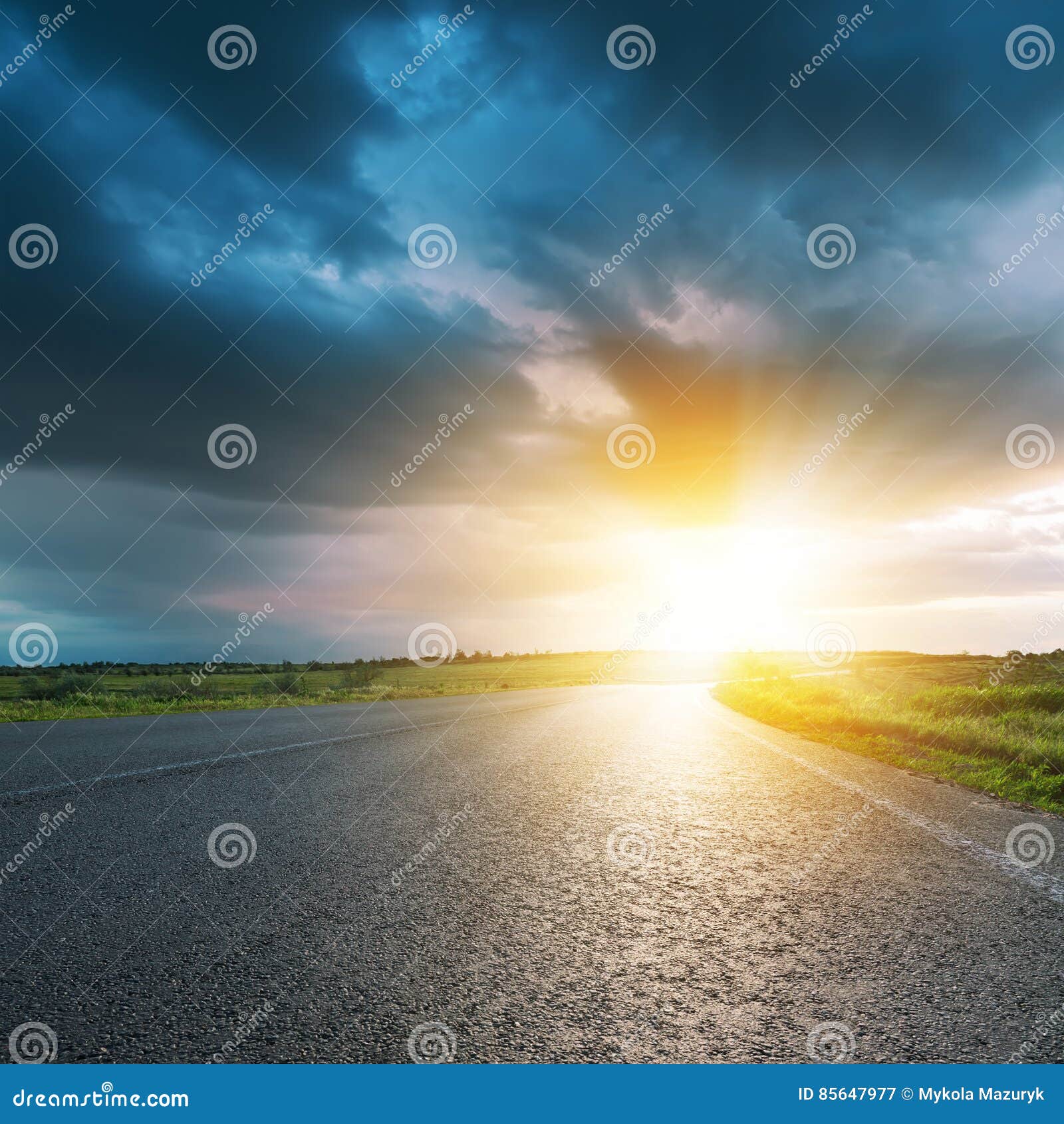 Dark Clouds and Yellow Sunset Over Asphalt Road Stock Image - Image of ...