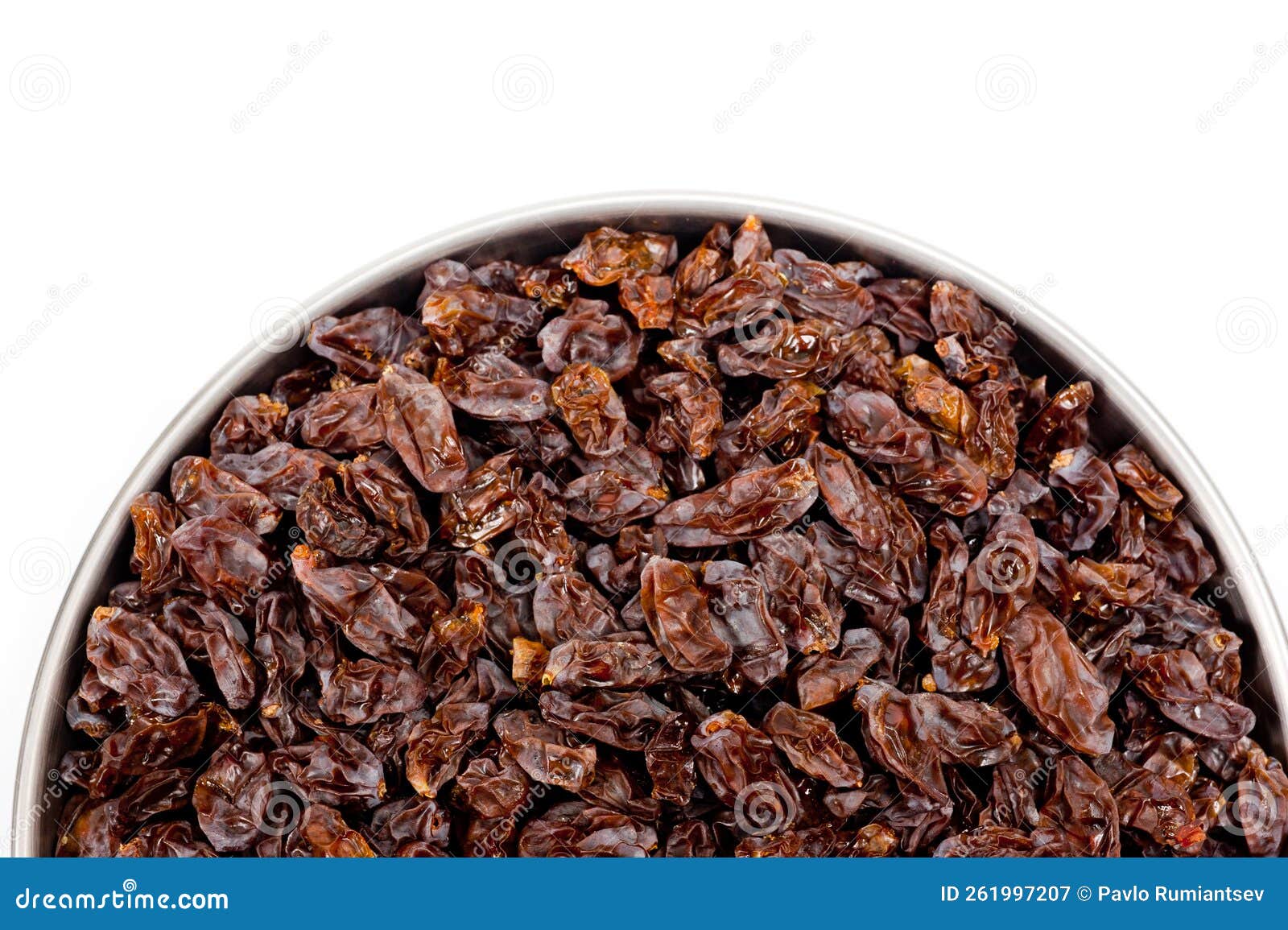 Dark-colored Raisins Lying in a Metal Container, Shot on a White ...