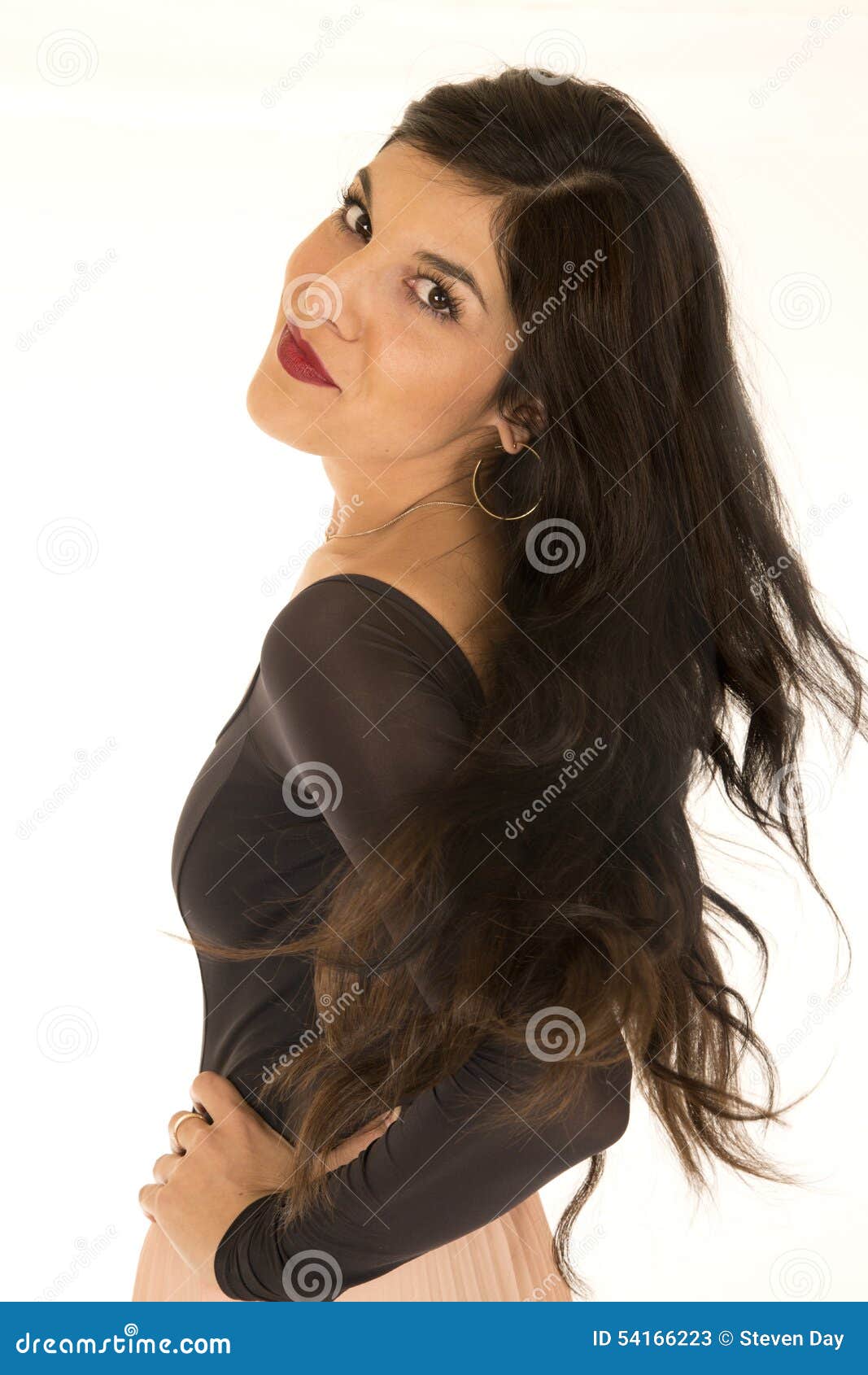 Dark Complected Woman Posing Looking Over Her Shoulder Stock Image ...