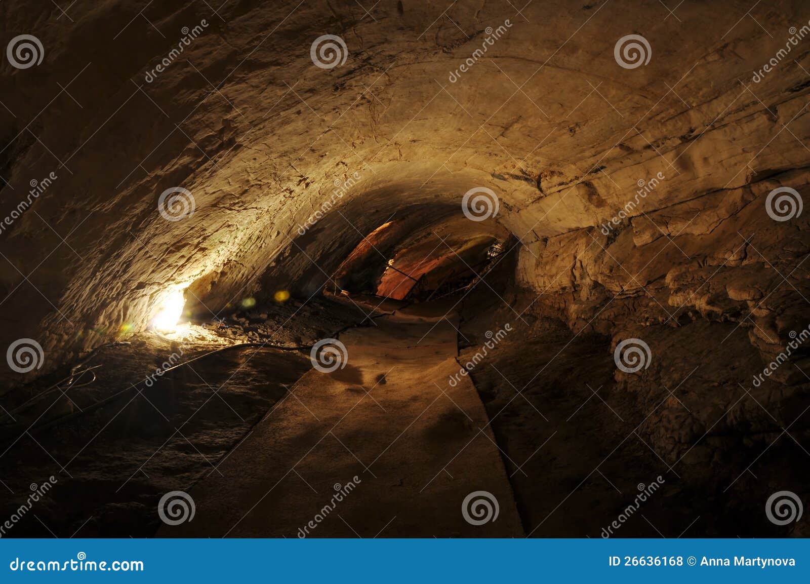 A dark corridor in a cave stock photo. Image of caving - 26636168