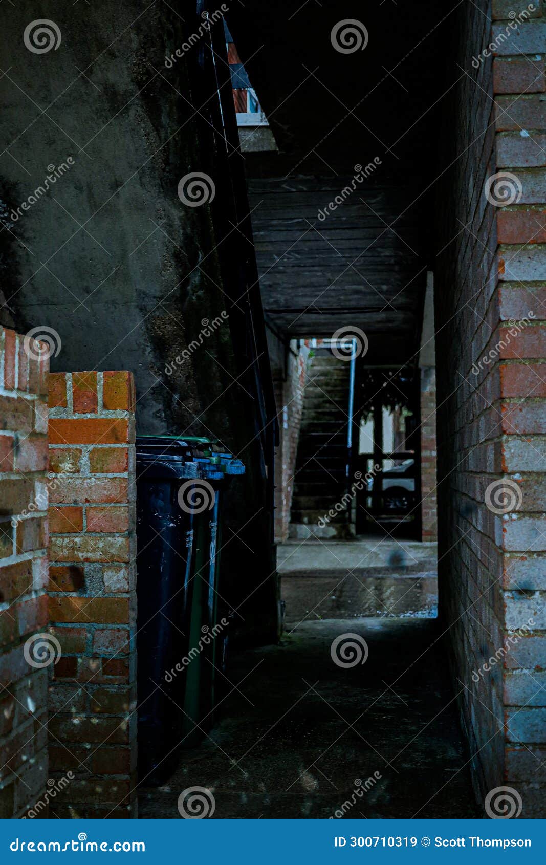 Dark and dingy alleyway stock image. Image of stairs - 300710319