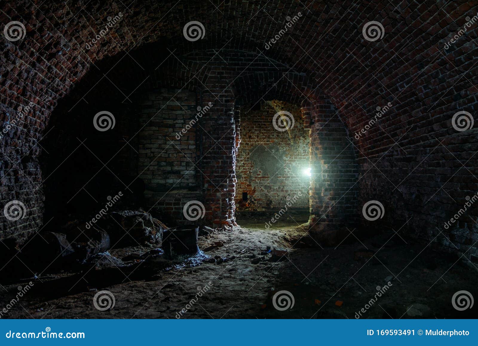 Dungeon Under The Old German Fortress Illuminated By Lantern And ...