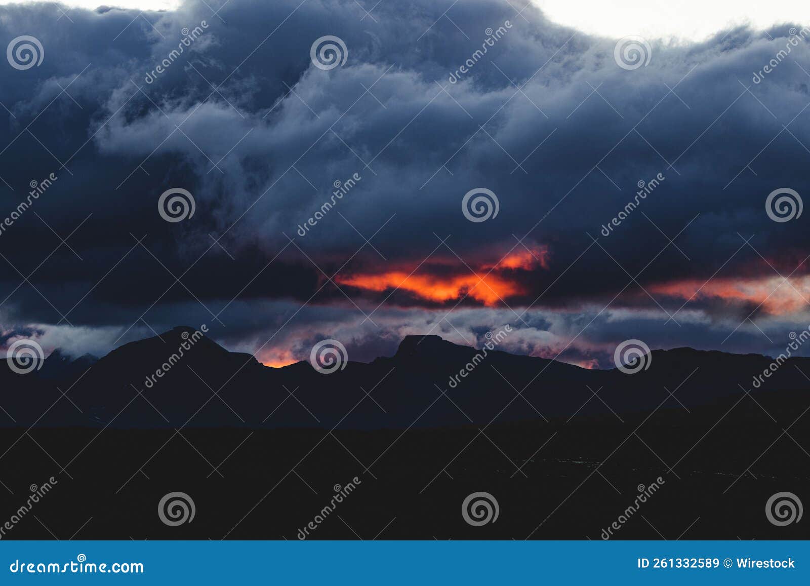Dark Fluffy Flaming Clouds Over the Hills Stock Image - Image of ...