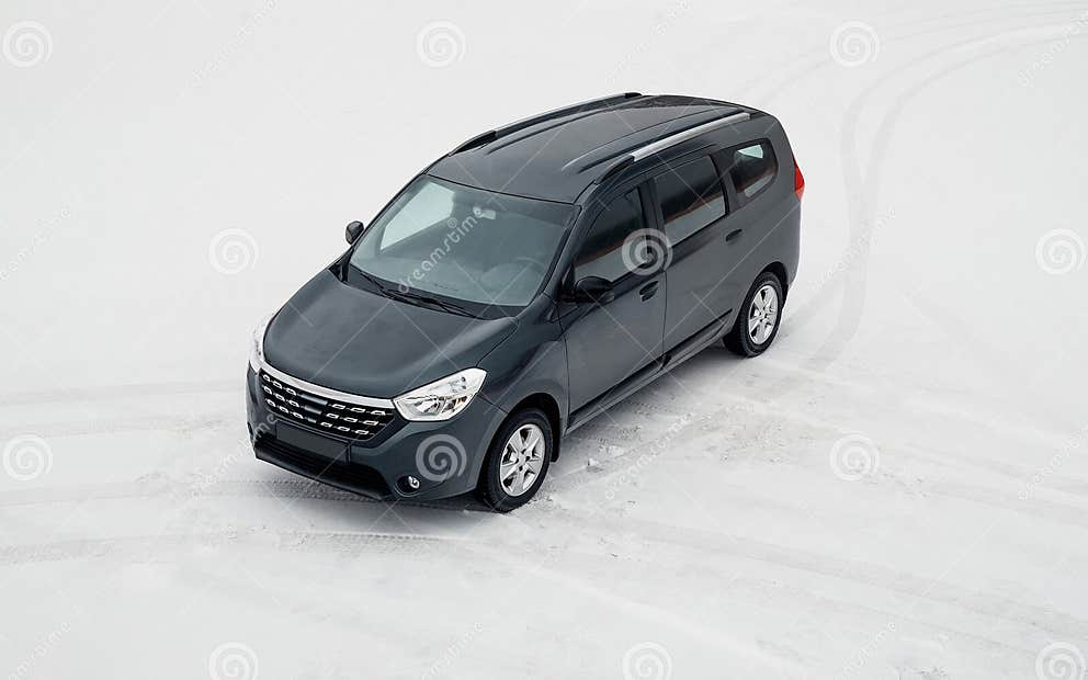 Dark grey minivan on snow. stock photo. Image of footprint - 354748668