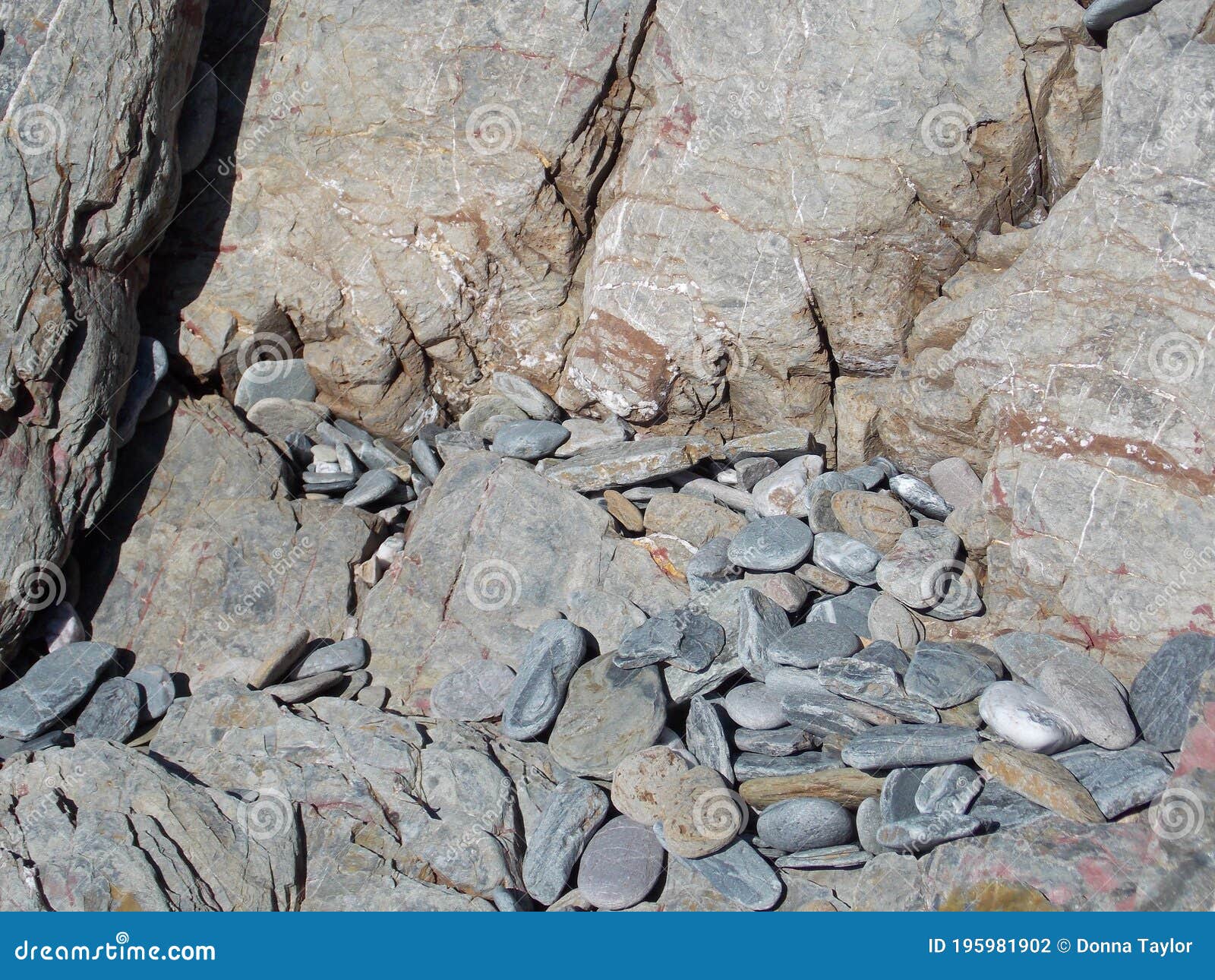 Pebbles and Rock Fall at the Beach Stock Photo - Image of cliff, rocks ...