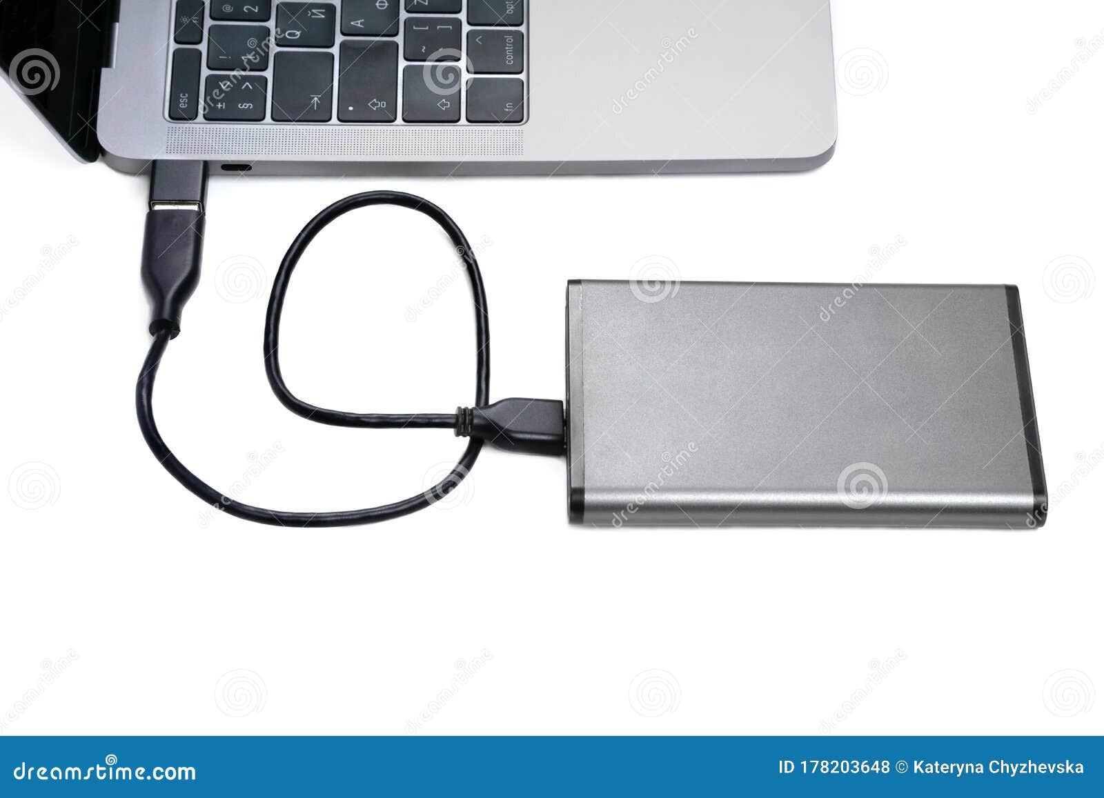 Dark Grey Portable Hard Disk Drive Connected To a Laptop Computer Via ...