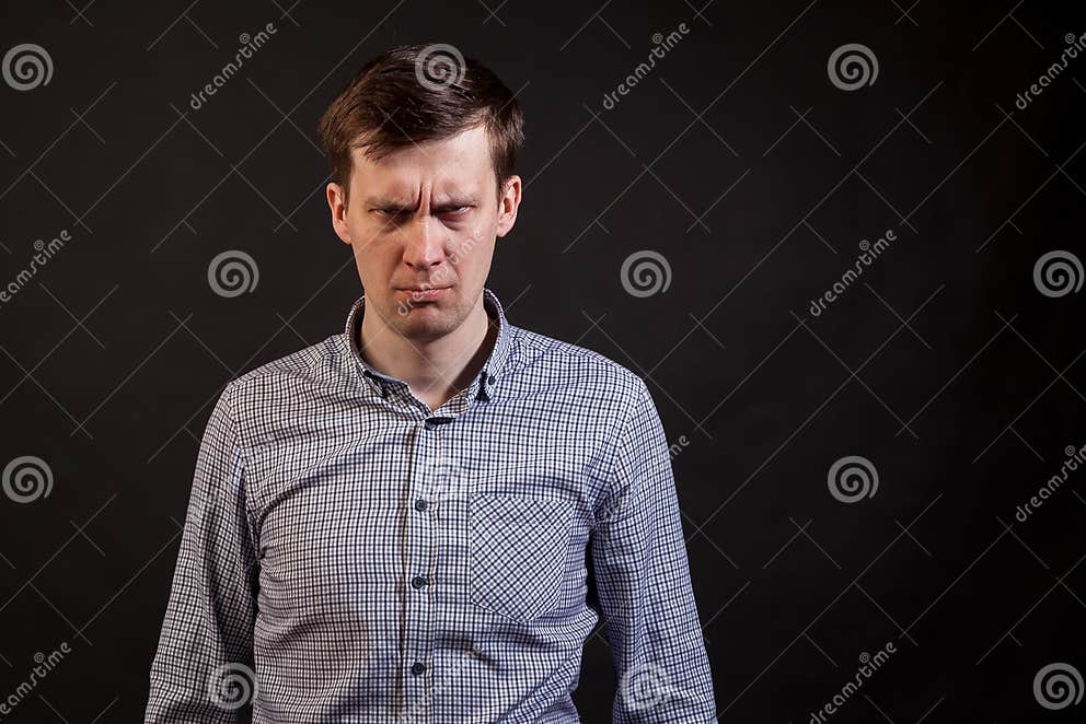 A Dark Haired White Man with a Distrust Expression Face Stock Photo ...