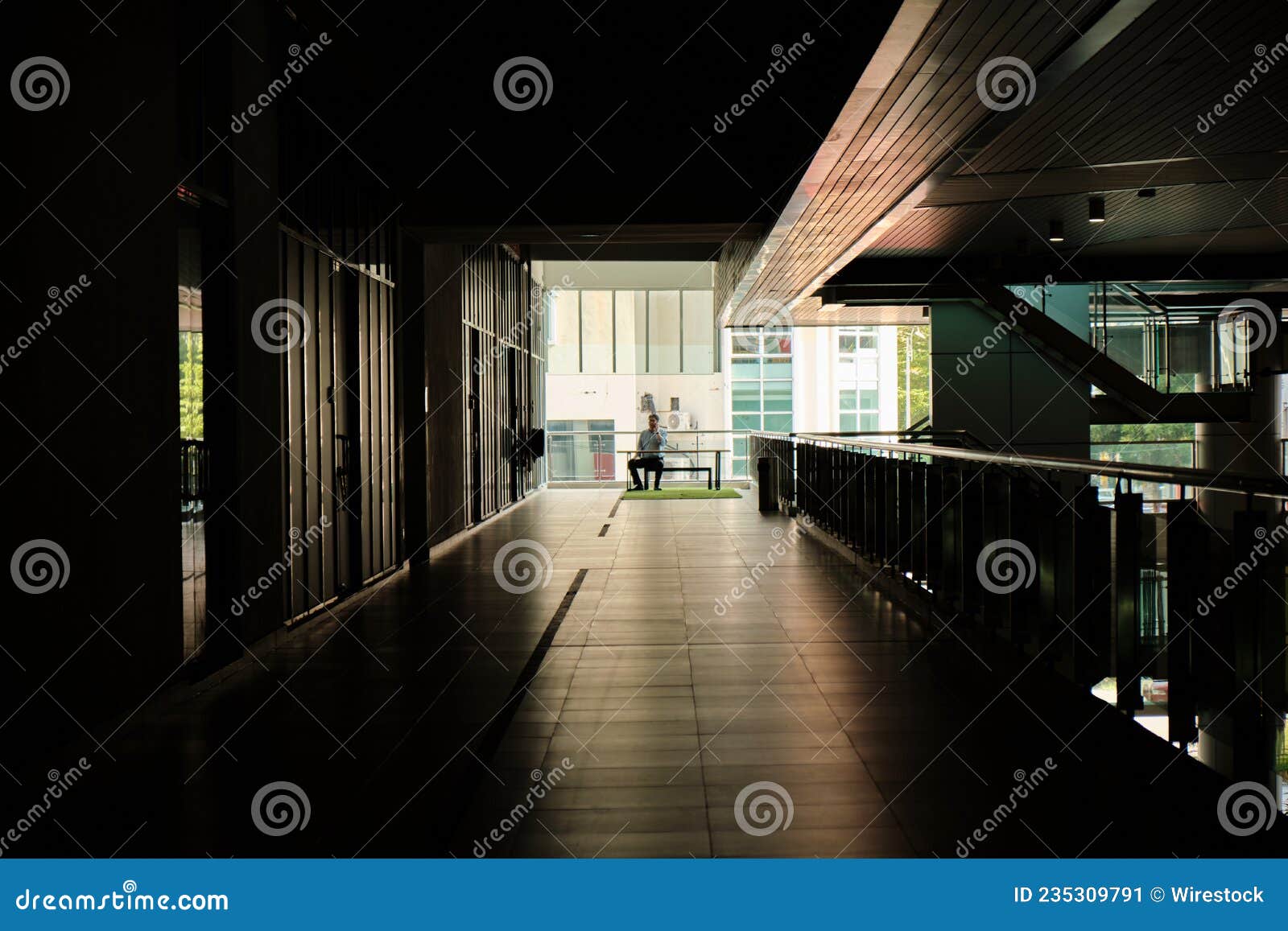 Dark Hallway of a Modern Building with Balconies on a Sunny Day Stock ...
