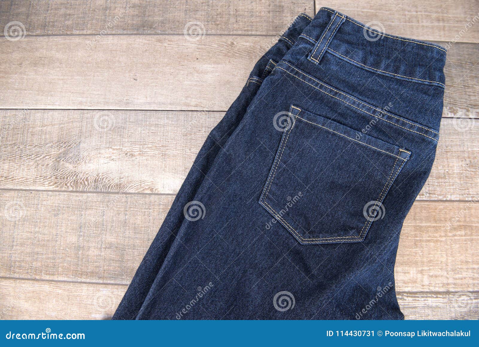 Dark Jeans Placed on a Wooden Floor Stock Image - Image of dark, jeans ...