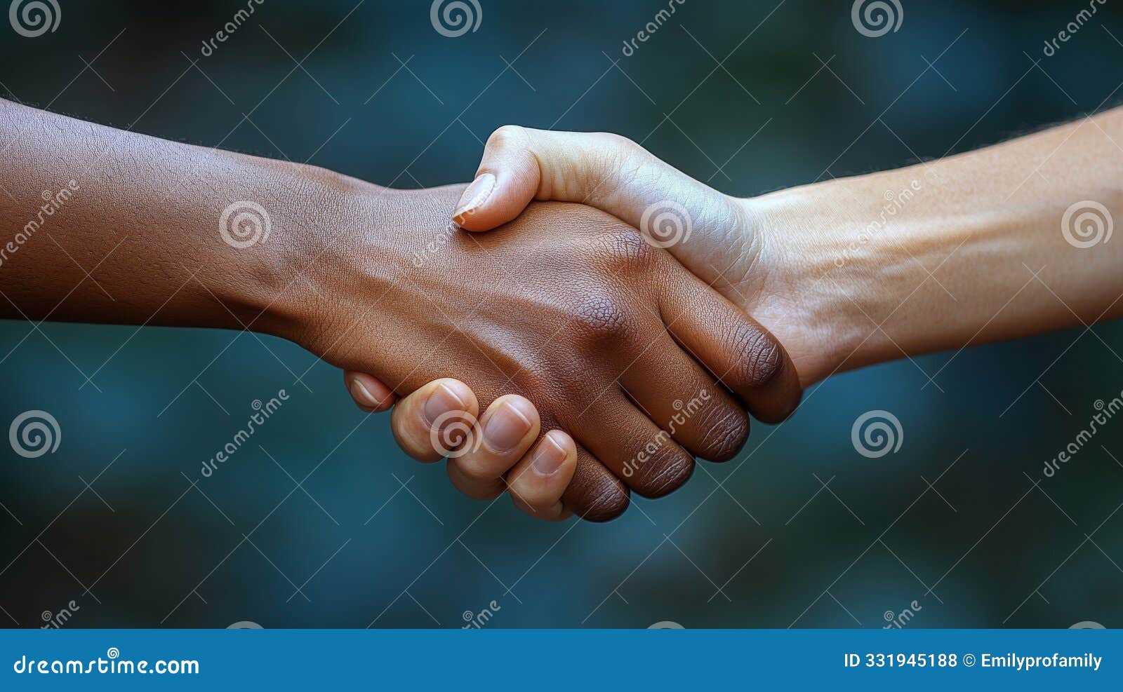 Two Hands Shaking in a Gesture of Friendship Against a Blurred Green ...