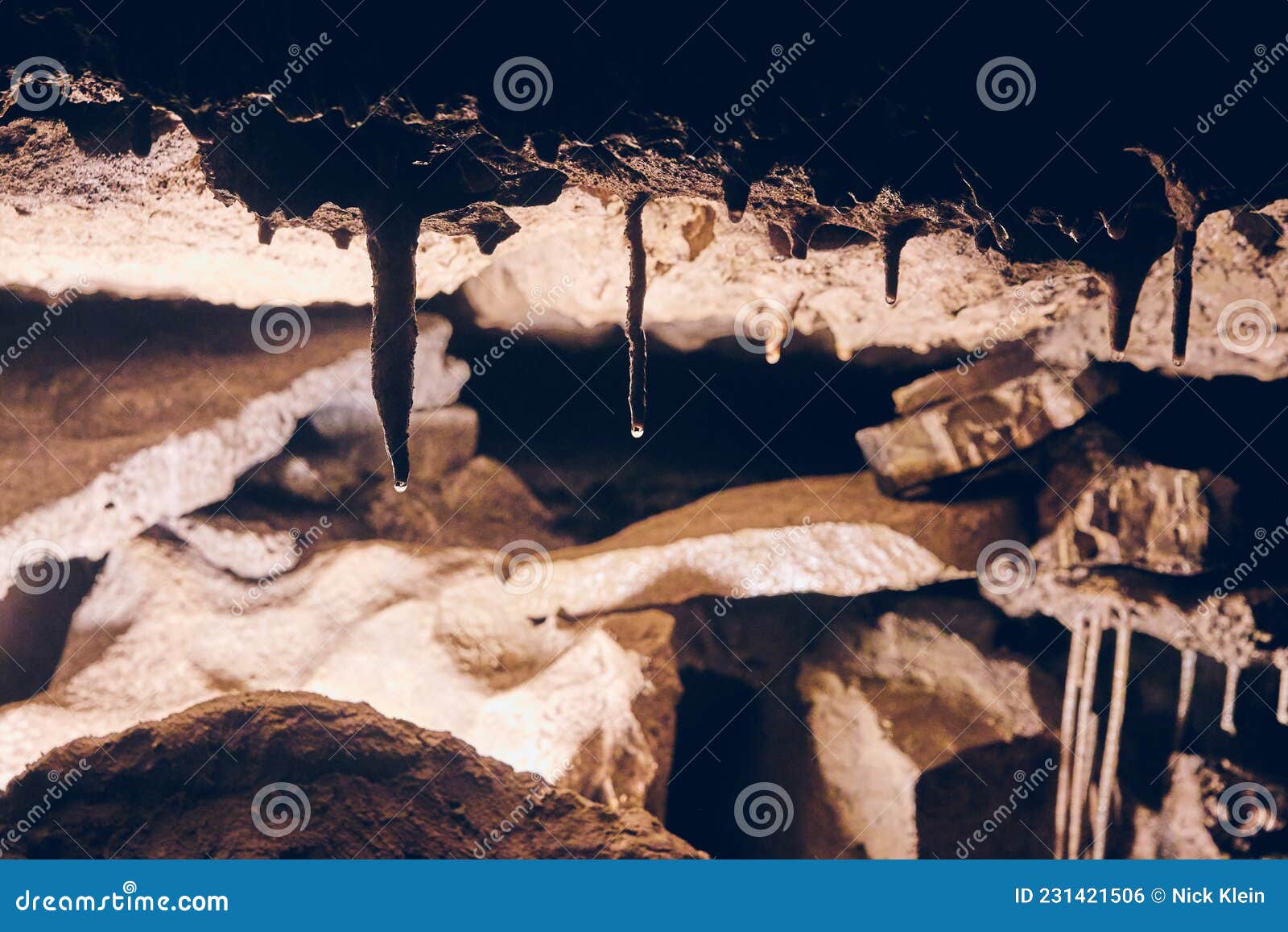 Dark Lighting of Cave Formations with Water Dripping Stalactites Stock ...
