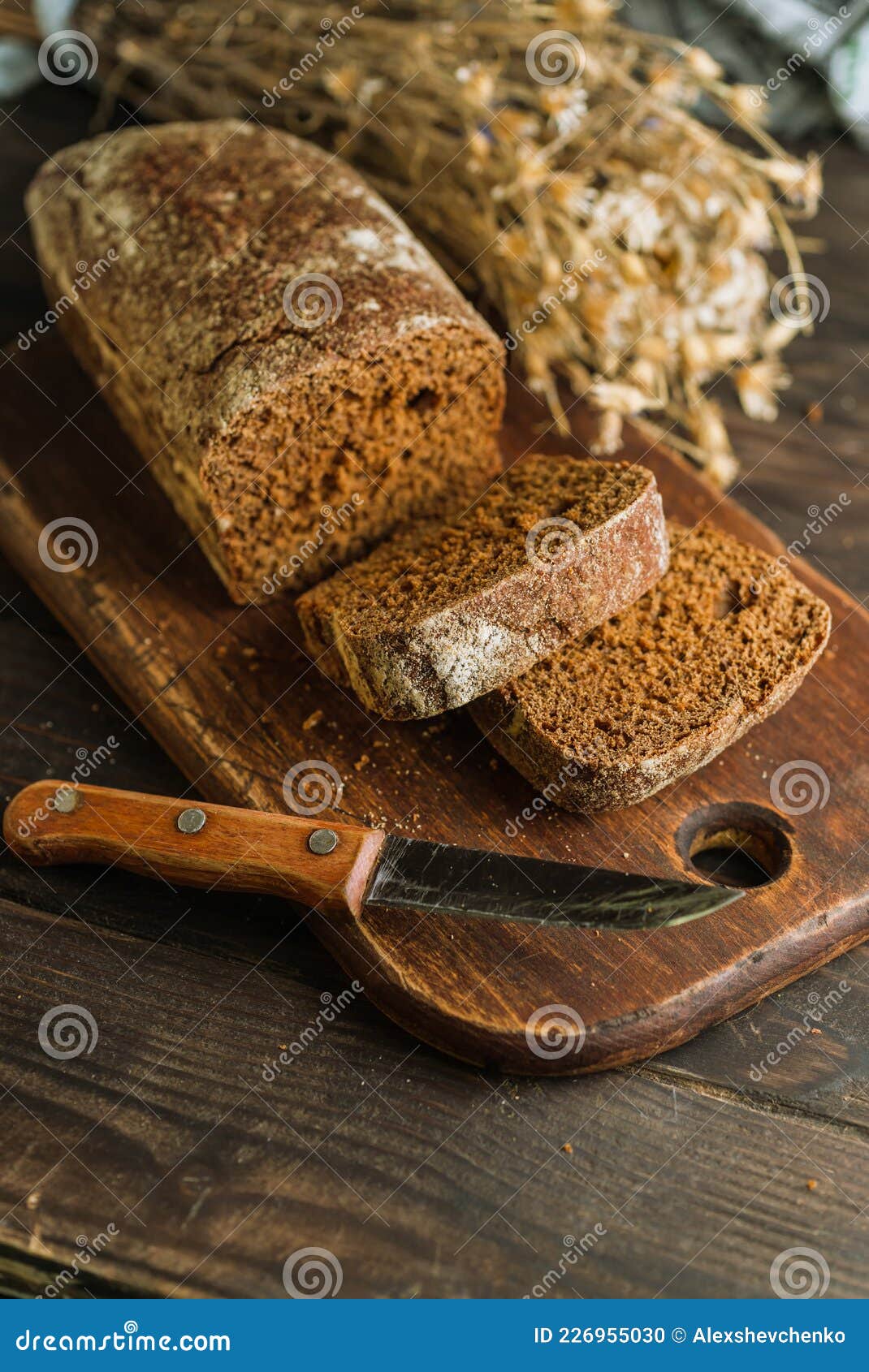 Dark Multigrain Cereal Bread on Rustic Wooden Board Stock Photo - Image ...