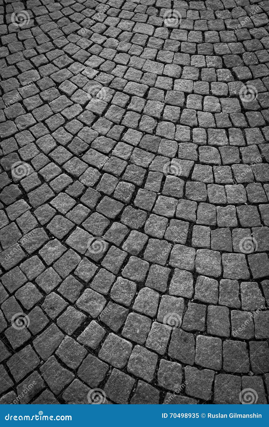 Dark paving stone roadway stock image. Image of cobbled - 70498935