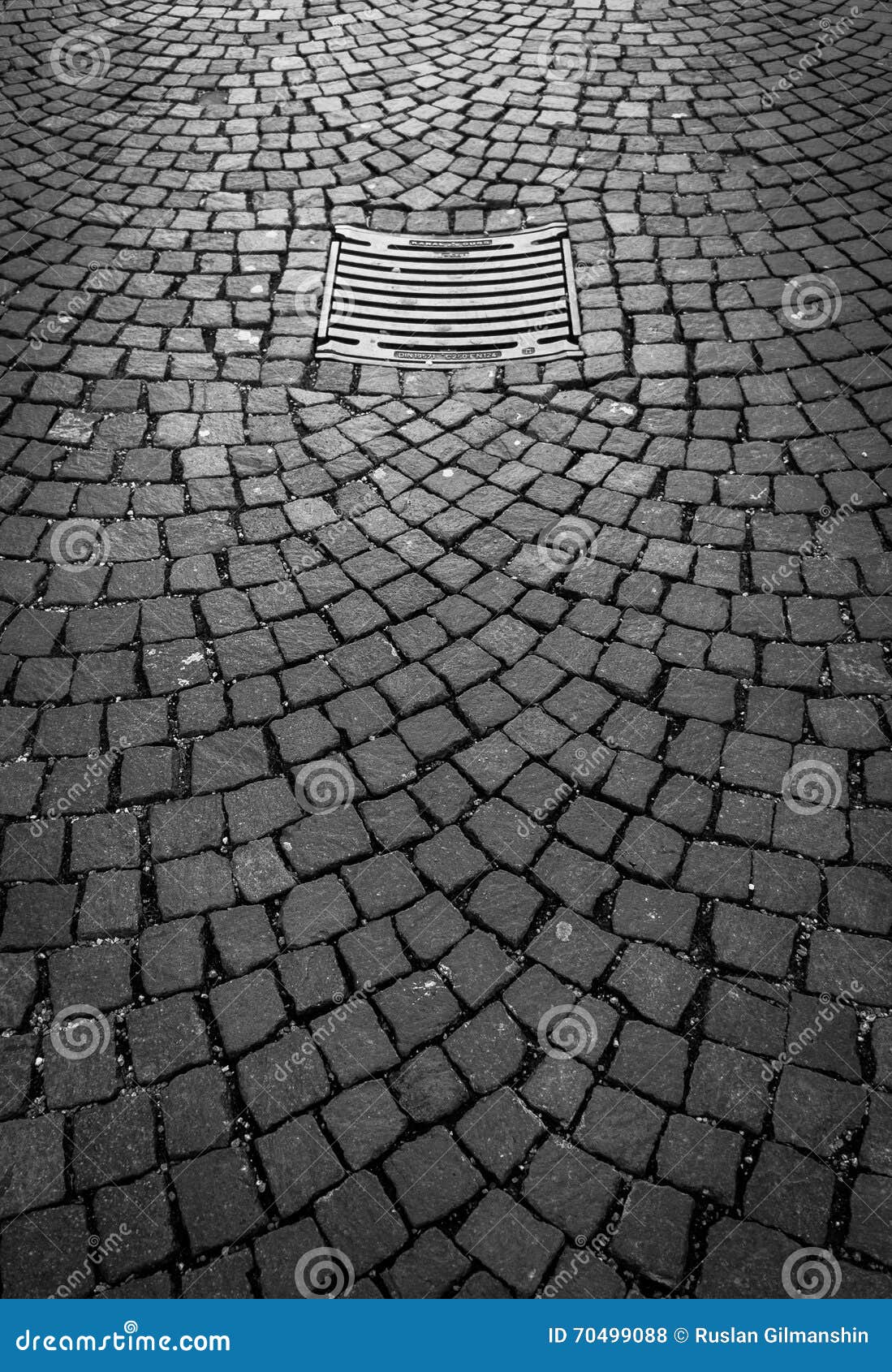Dark paving stone roadway stock photo. Image of grey - 70499088