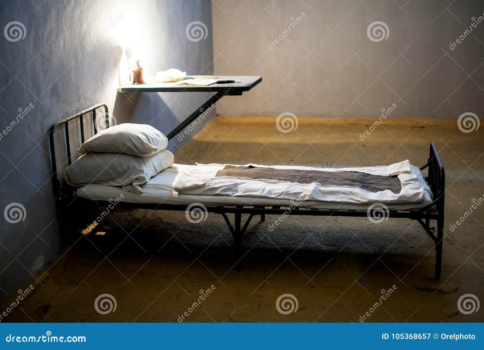 Dark prison cell with bed stock image. Image of detention - 105368657