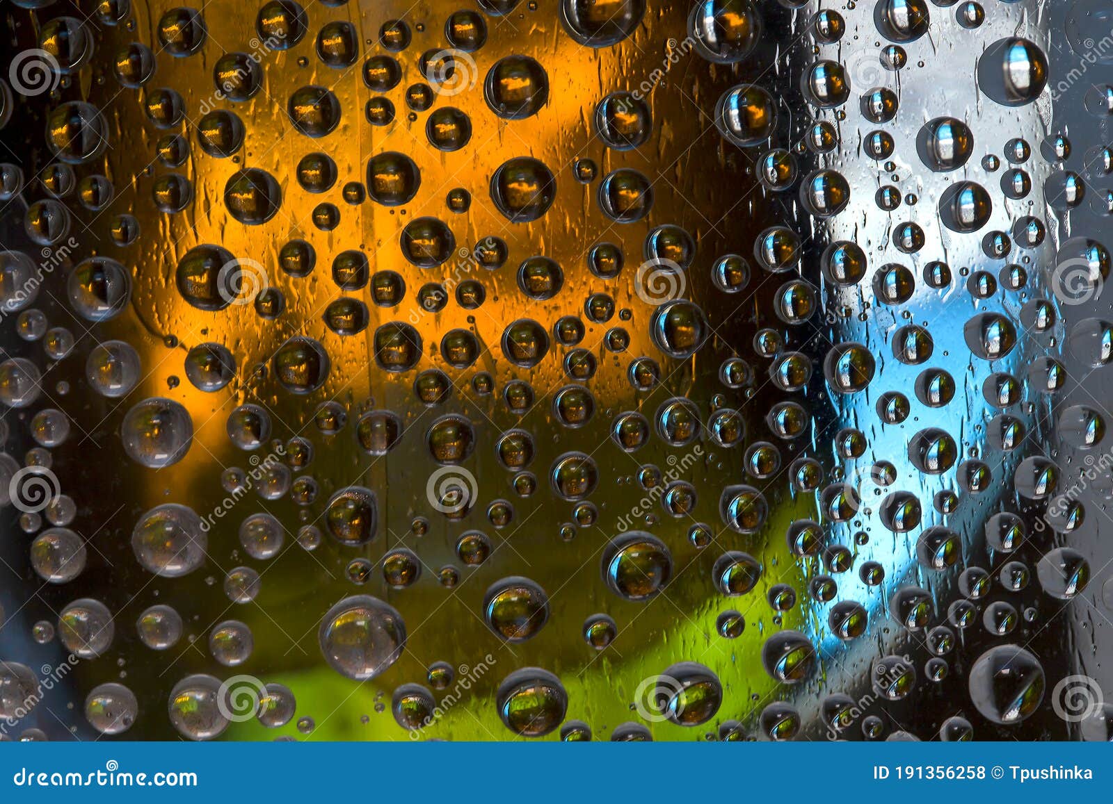 Dark Raindrops are Falling Down Against the Multi-colored Background ...