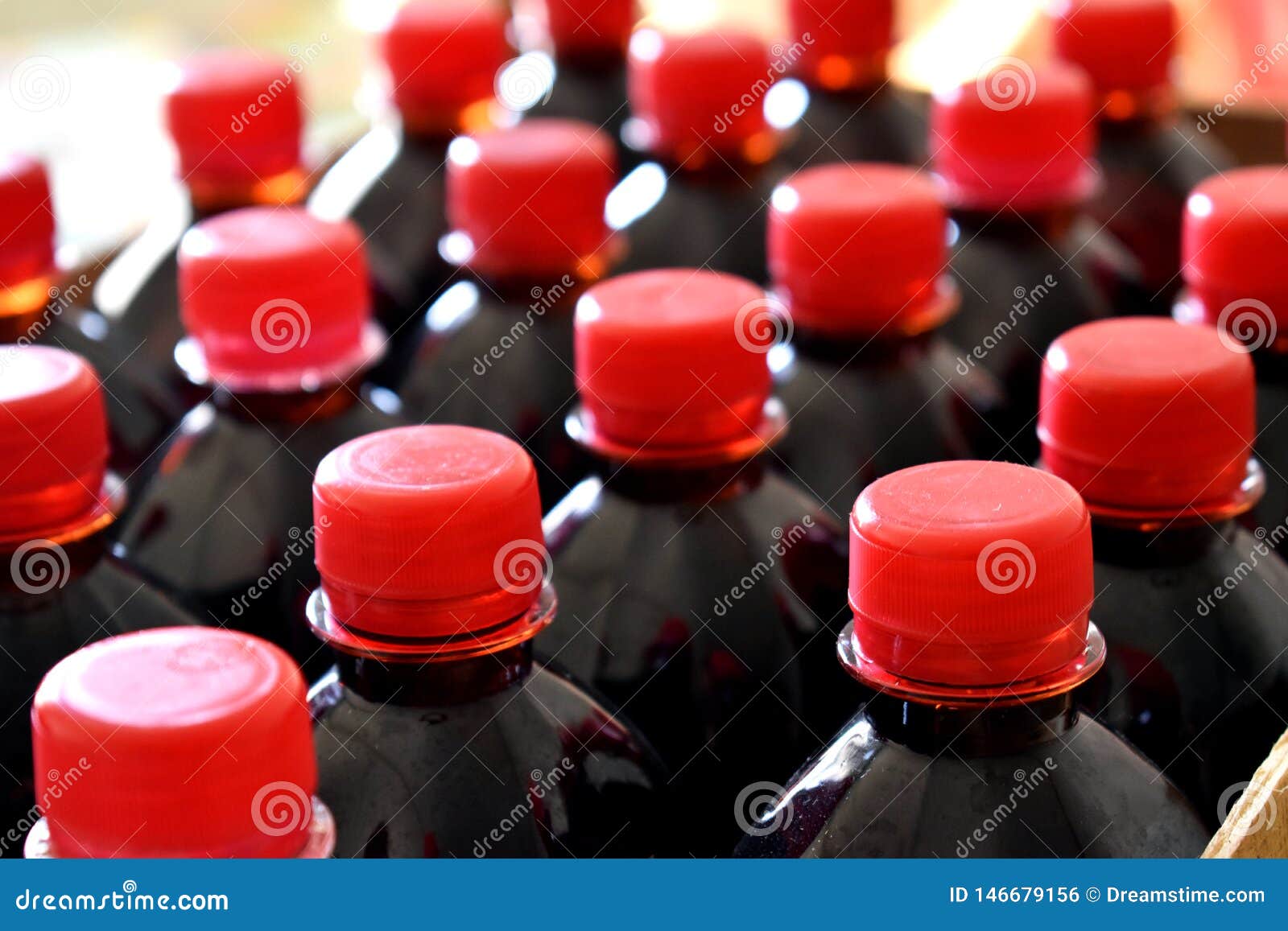 A Dark Red Fruit Syrups in Plastic Bottles with Red Lids are Ready for ...
