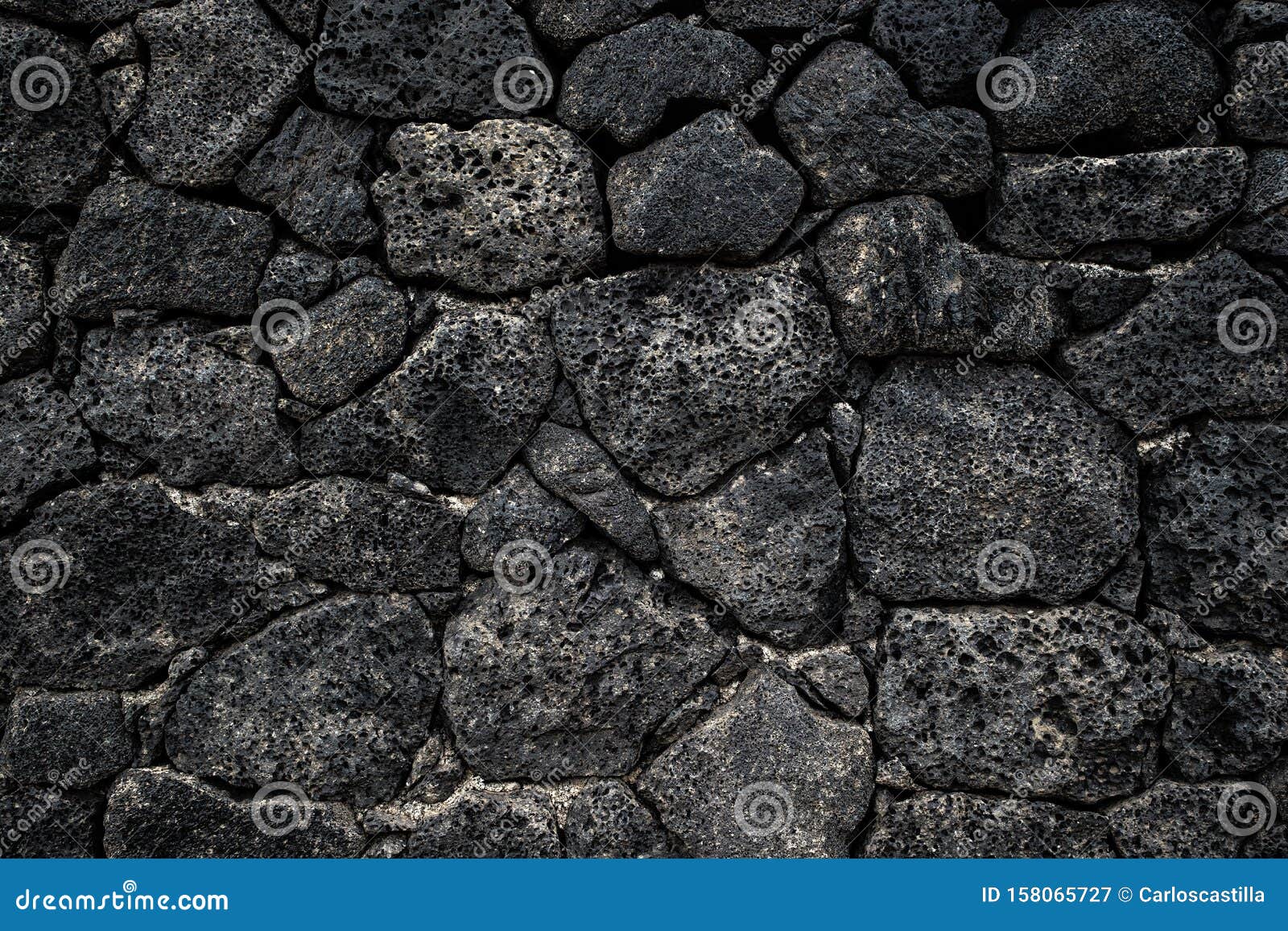 Black volcanic stone wall stock image. Image of natural - 158065727